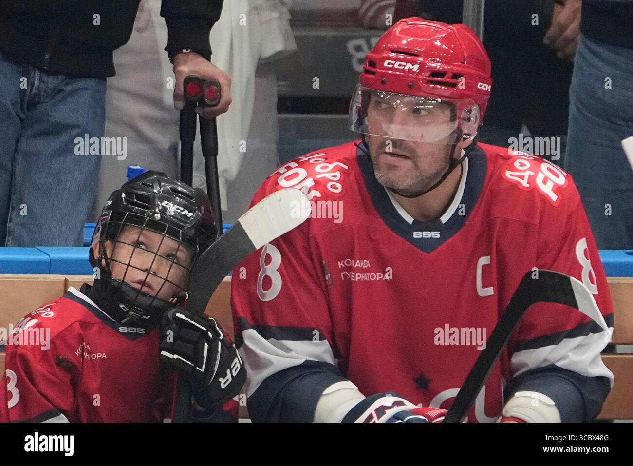 Alex Ovechkin of Washington Capitals, right, and his son Sergei sit on ...