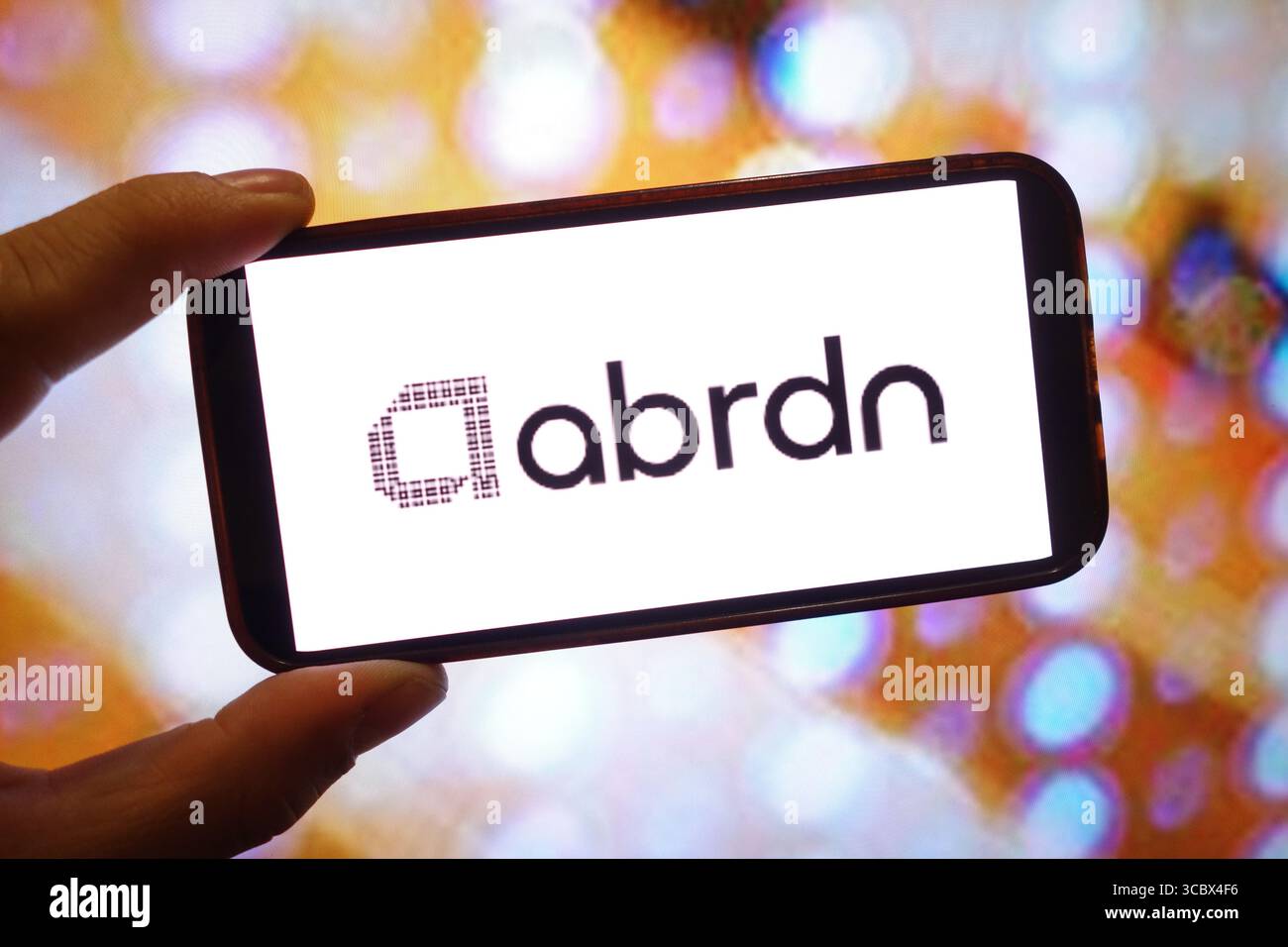 In this photo illustration, a Abrdn company logo is seen displayed on a ...