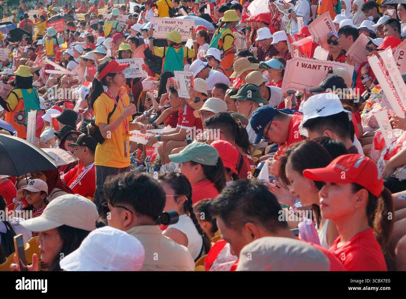 Singapore Aug 02 2025 – Crowds dressed in red and white fill the ...