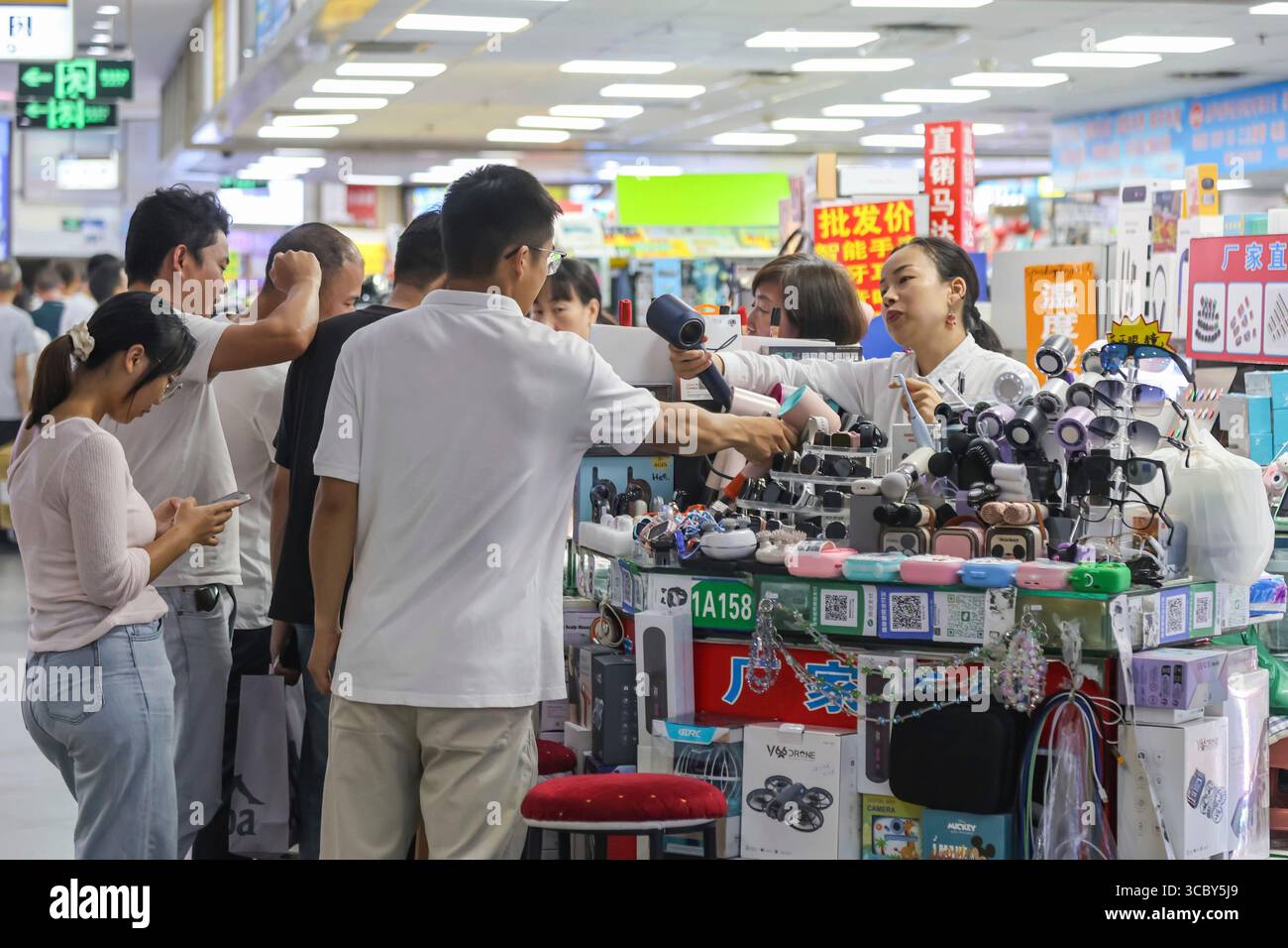 People trade at Huaqiangbei electronics market in Shenzhen in south ...