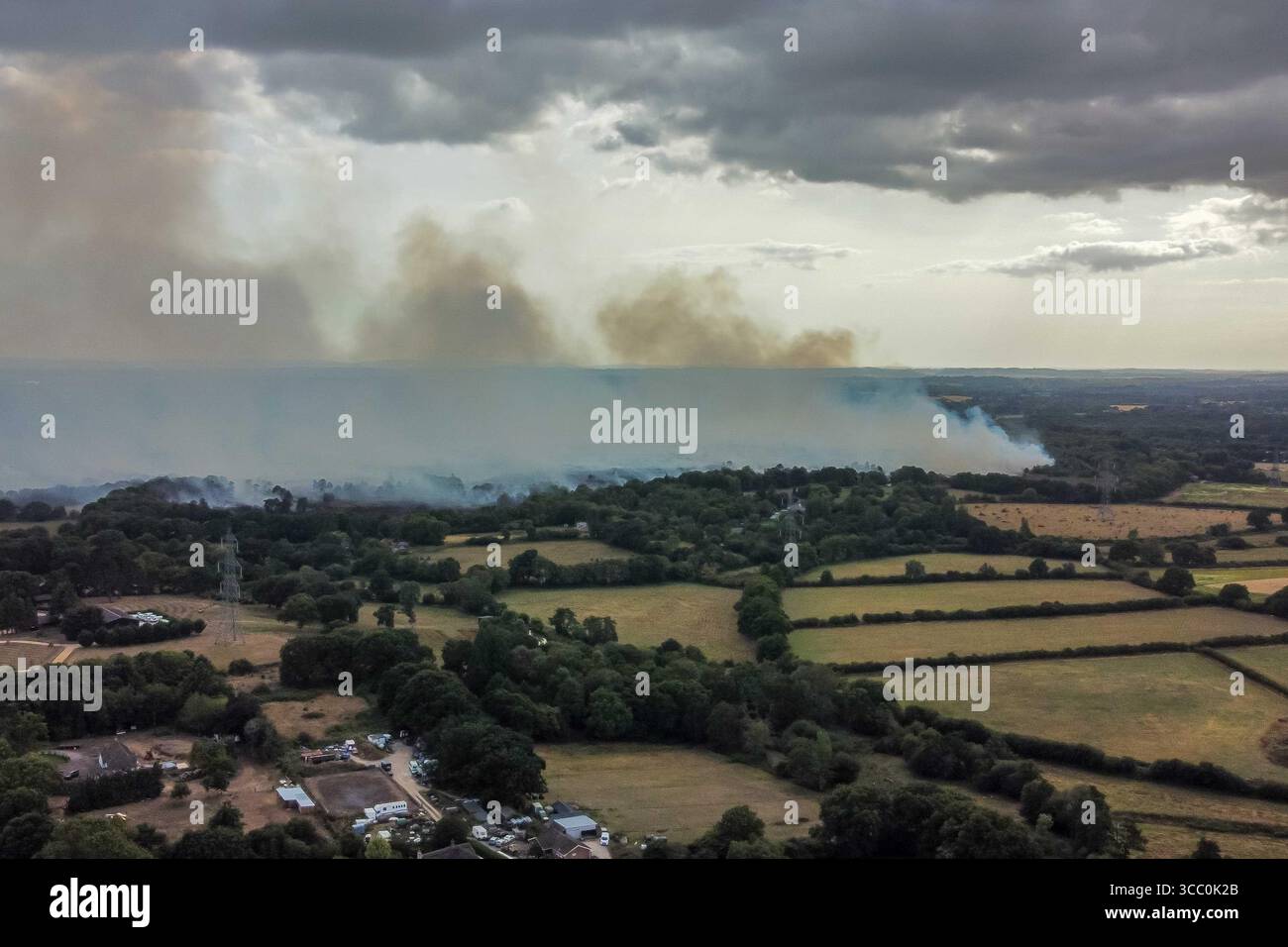 Holt, Dorset, UK. 9th August 2025. UK Weather. Aerial view towards the ...