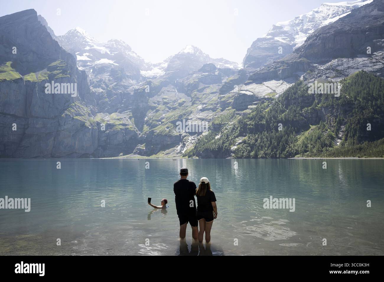 Tourists visit Oeschinen Lake, 1578 meters (5177 feet) above sea level ...