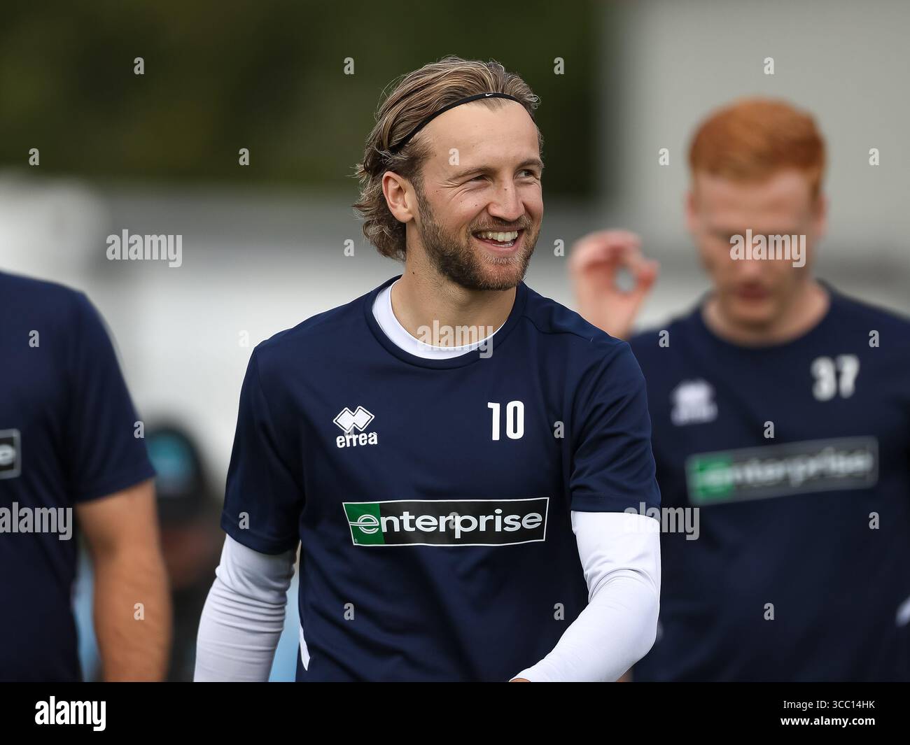 Brackley, UK. 9th August 2025. Morgan Roberts of Brackley Town warms up ...