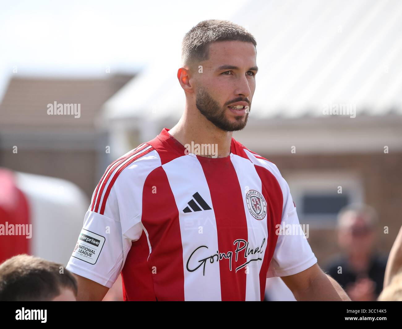 Brackley, UK. 9th August 2025. Zak Lilly of Brackley Town walks out ...