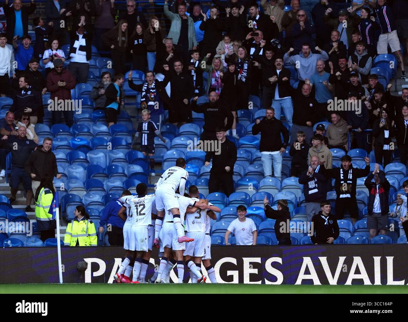 Dundee's Ryan Astley (right) celebrates scoring their side's first goal ...