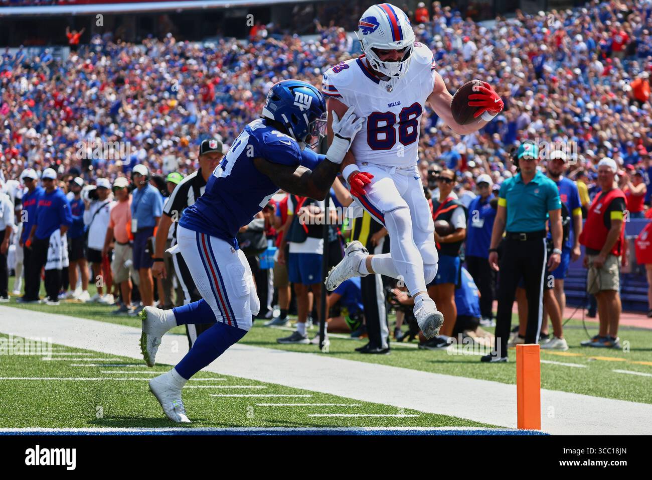 Buffalo Bills' Dawson Knox (88) runs past Buffalo Bills' Keonta Jenkins ...