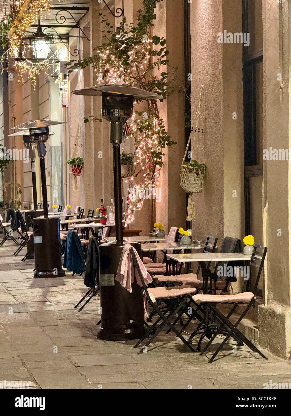 Cozy evening street scene in Athens, Greece, featuring outdoor dining ...