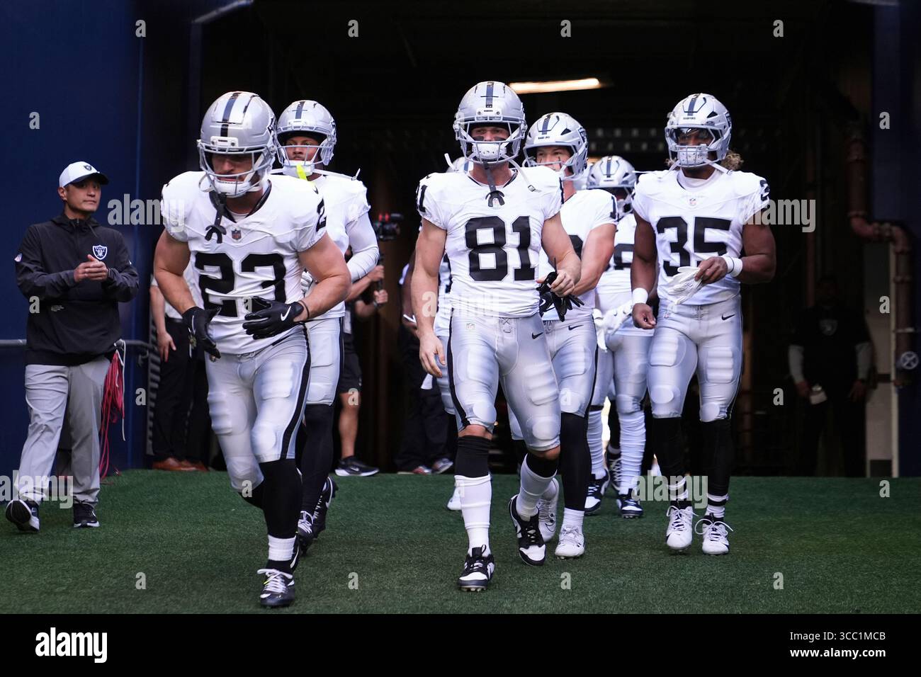 Las Vegas Raiders players, including running back Dylan Laube (23) and ...