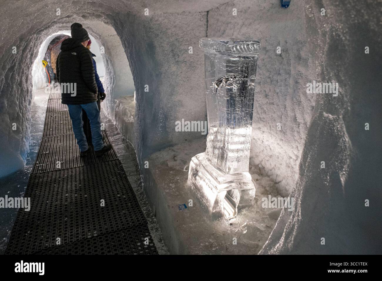 Tourist viewing exhibits in the Mittelallalin Ice Pavilion, Saas-Fee ...