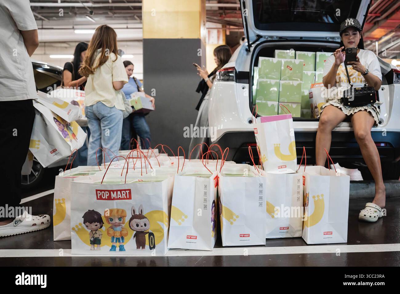 August 9, 2025, Bangkok, Thailand: Shoppers seen with numerous POP MART ...