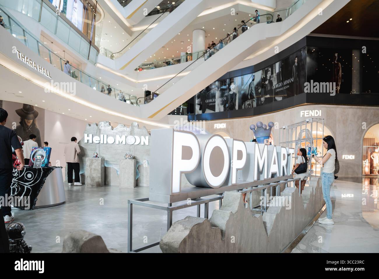 Bangkok, Thailand. 9th Aug, 2025. Visitors walk past the "HELLO MOON ...