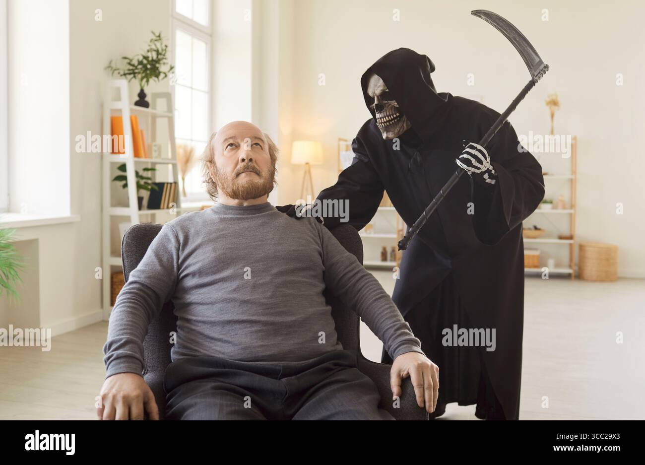 Grim Reaper Visiting Scared Man At Home Stock Photo - Alamy