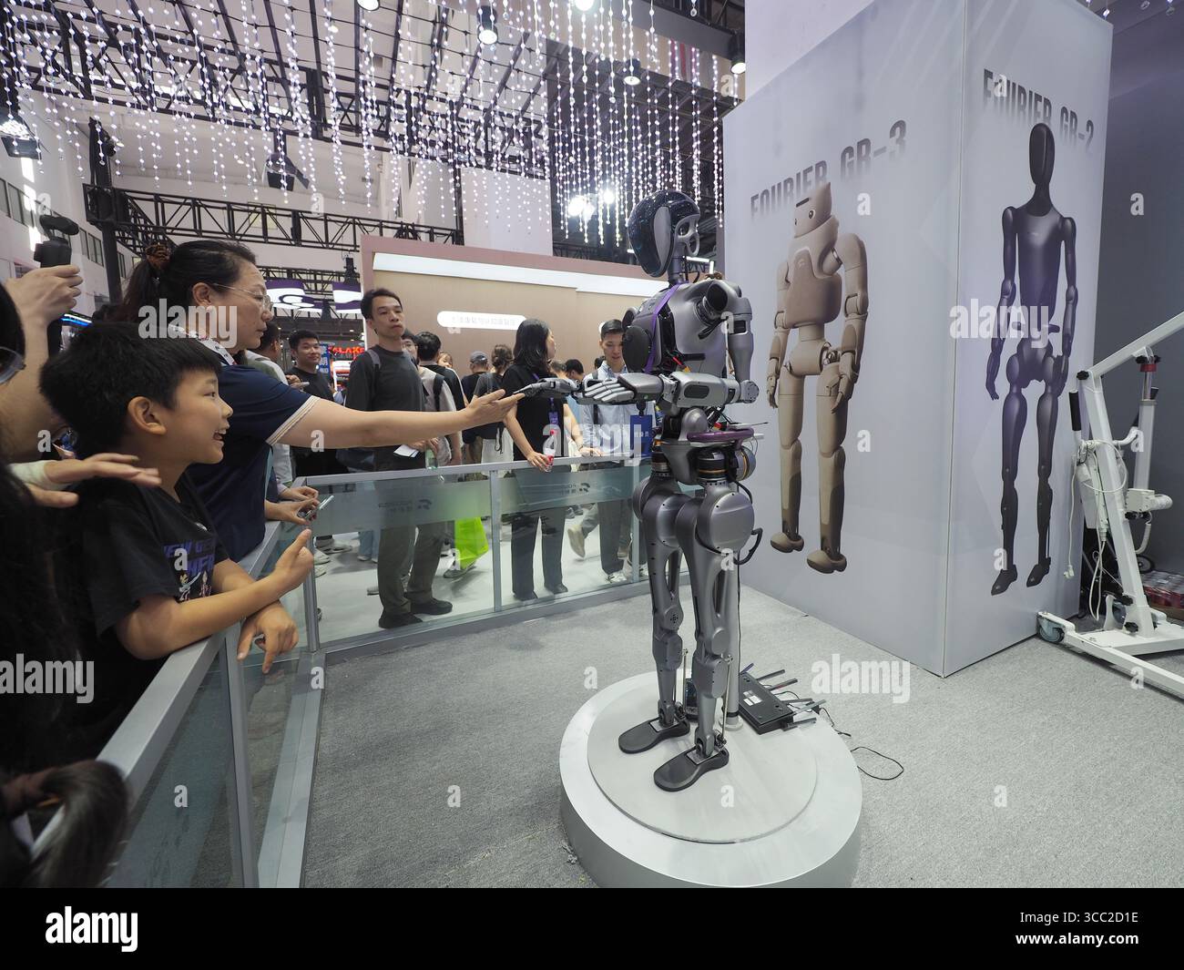 The audience interacts with a humanoid robot at the 2025 World Robot ...
