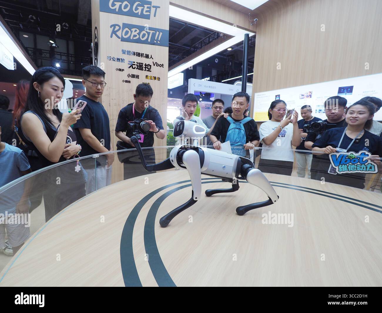 A viewer controls a quadruped robot through voice commands at the 2025 ...