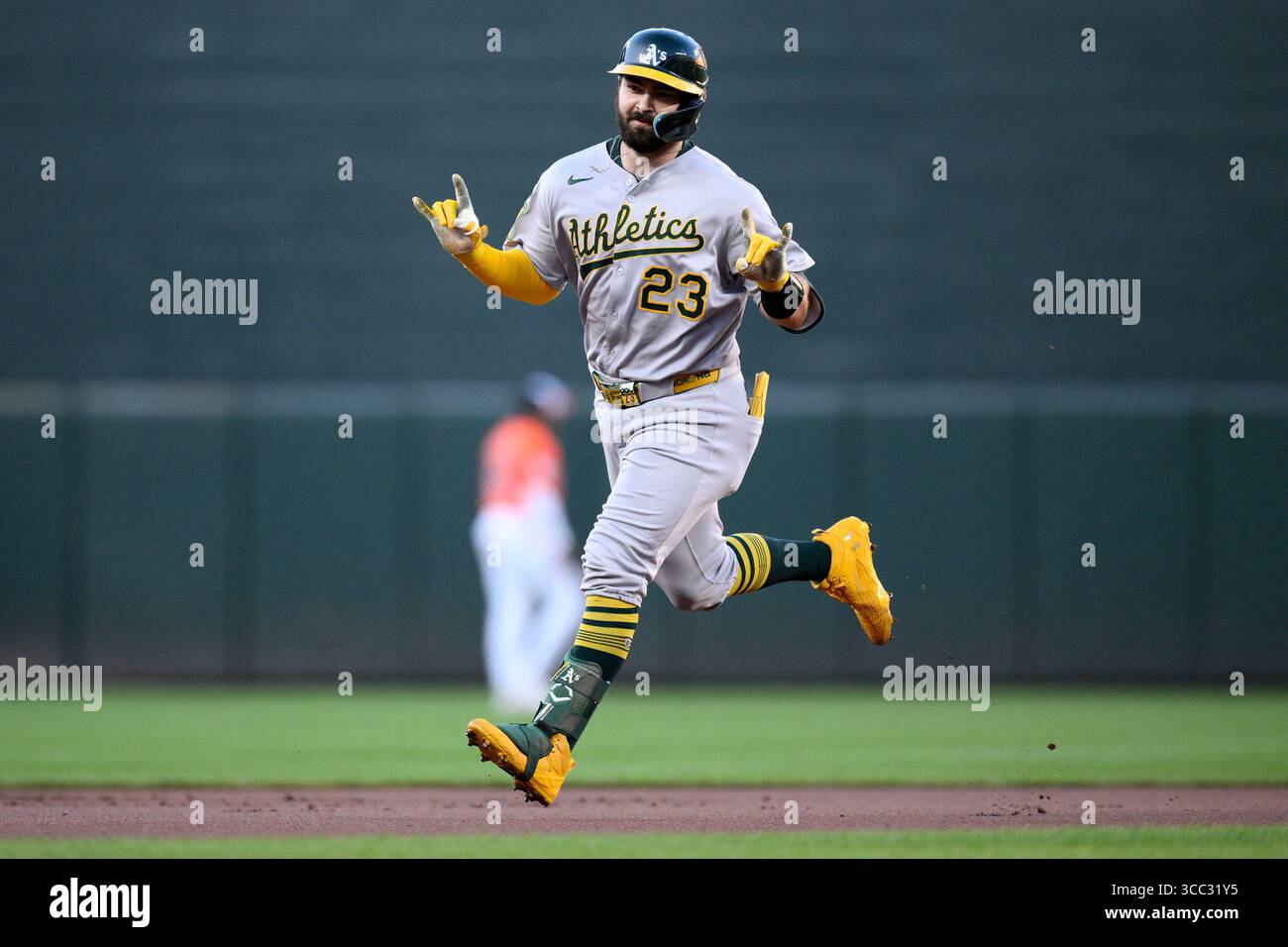 Athletics' Shea Langeliers celebrates his two-run home run as he rounds ...