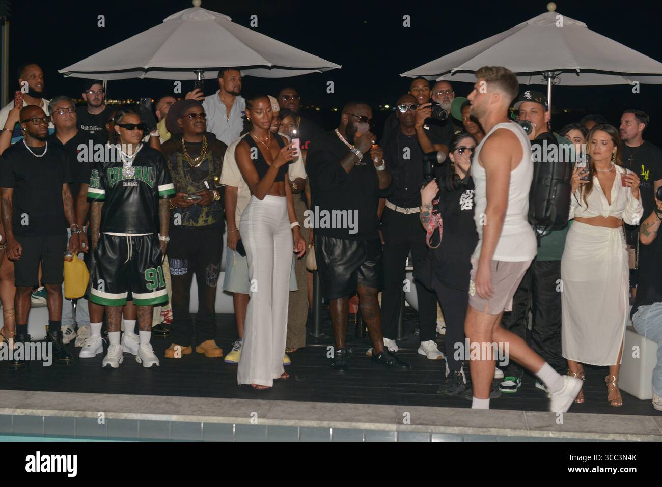 HOLLYWOOD, FLORIDA - AUGUST 08: Young Ma, Rick Ross and girlfriend ...