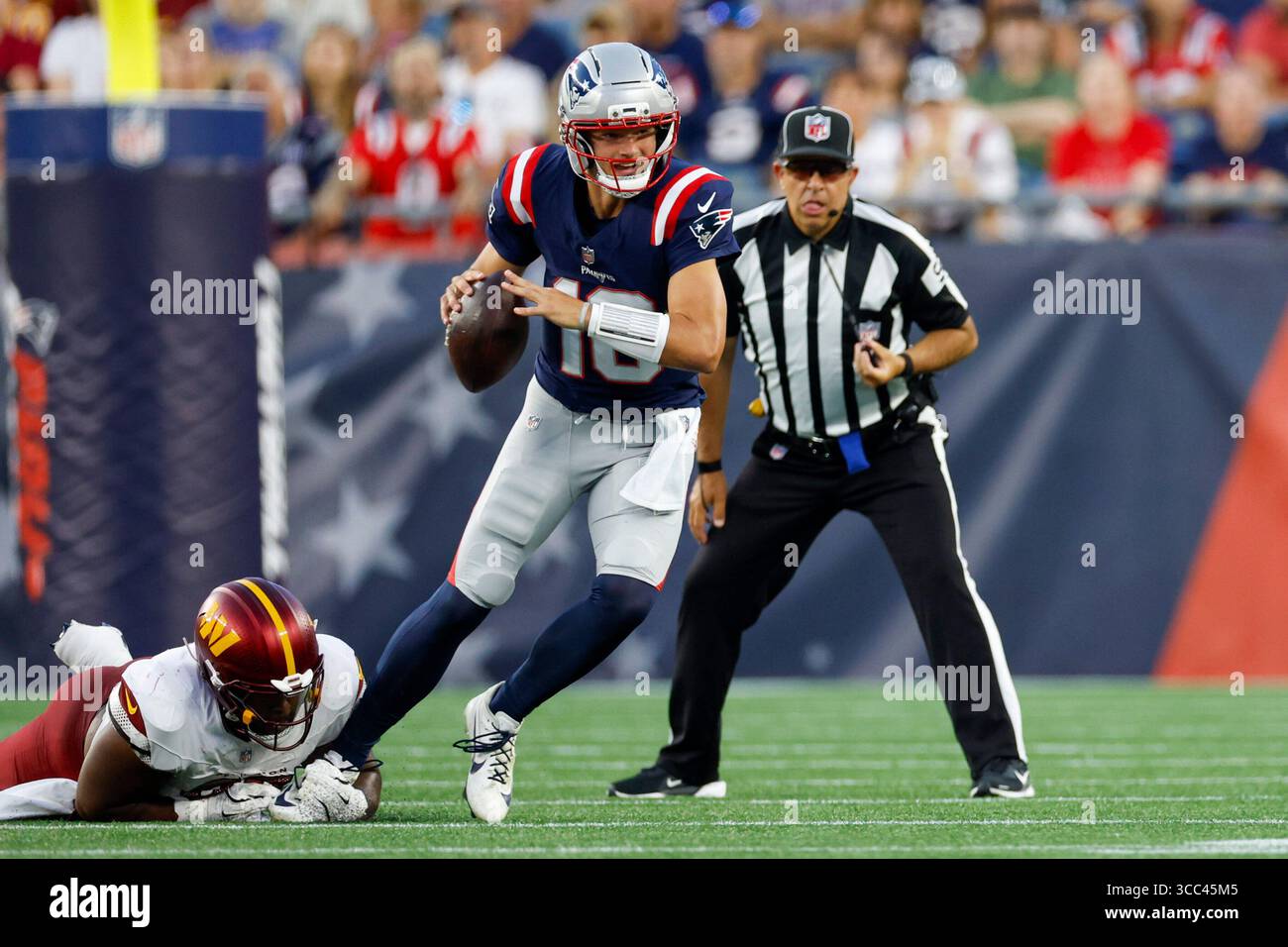 New England Patriots quarterback Drake Maye (10) is tackled by ...