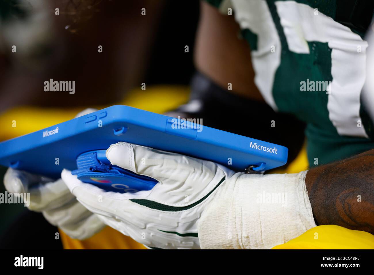 Green Bay Packers offensive tackle Jordan Morgan (77) looks at a ...