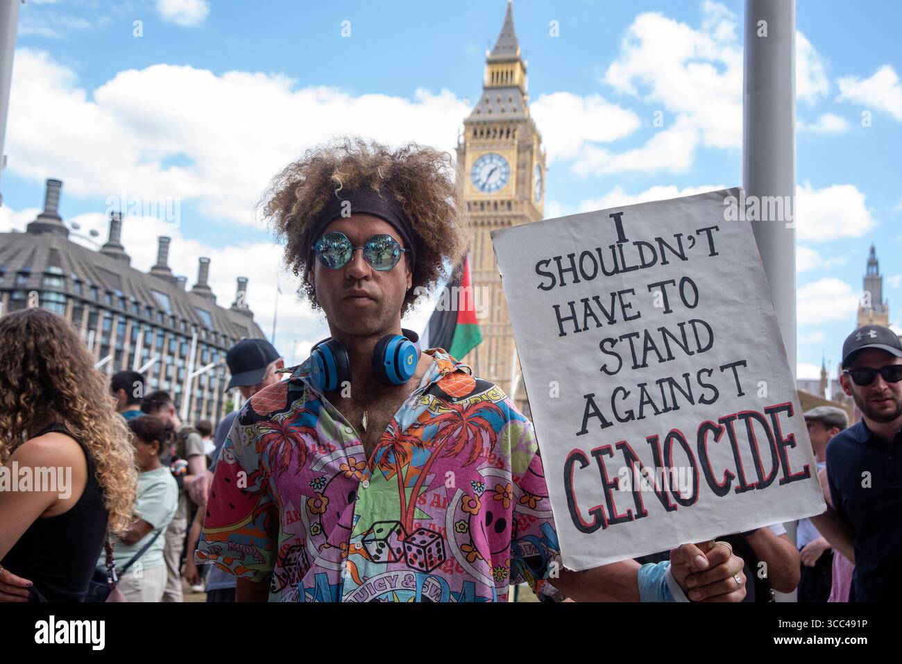 A protester poses with his placard front of the Big Ben during the ...