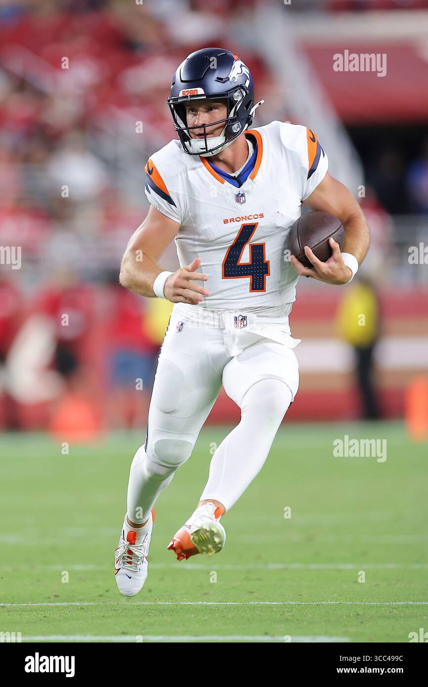 Denver Broncos quarterback Sam Ehlinger (4) runs during the second half ...