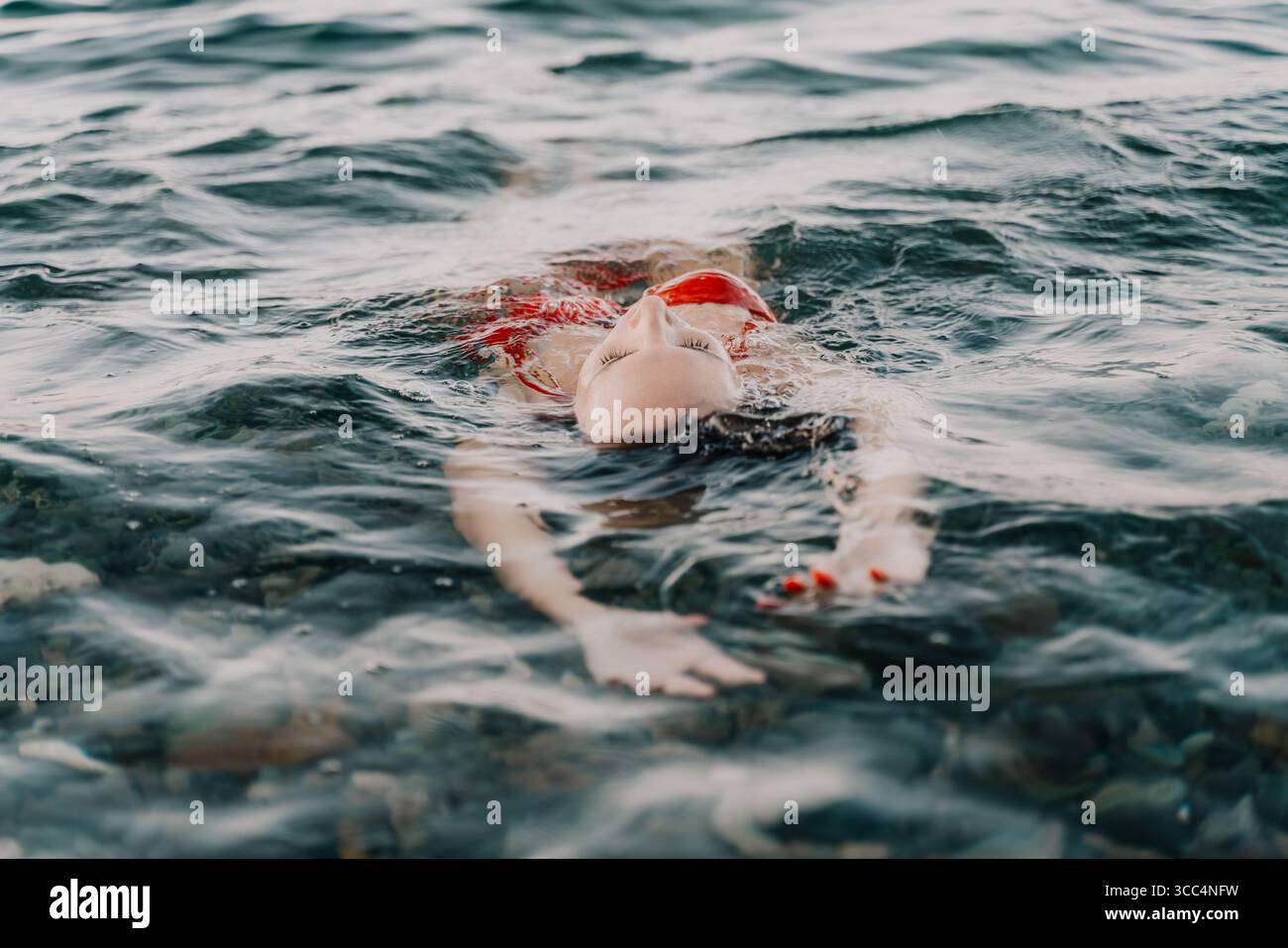Woman floating peacefully on back hi-res stock photography and images ...