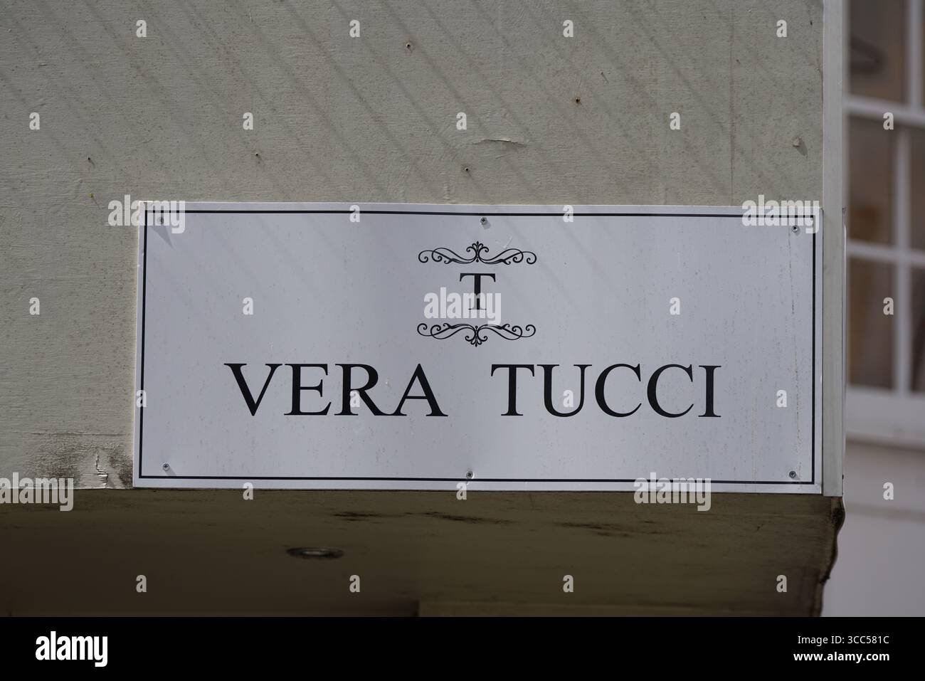 Elegant Shop Sign Displaying Business Name and Decorative Design ...
