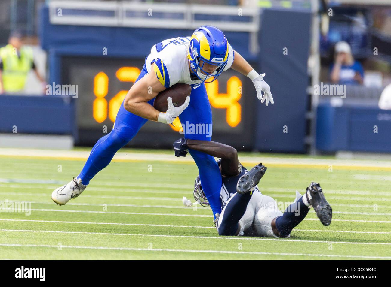 Los Angeles Rams tight end Davis Allen #87 is tackled by Dallas Cowboys ...