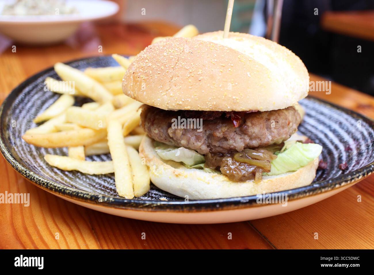 Maltese burger (Maltese rabbit meat hamburger) with French fries in ...