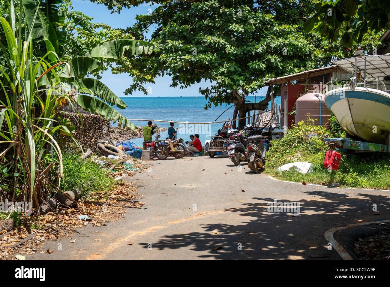 Members of the fishing community are working, at Bai Lan Village. Koh ...