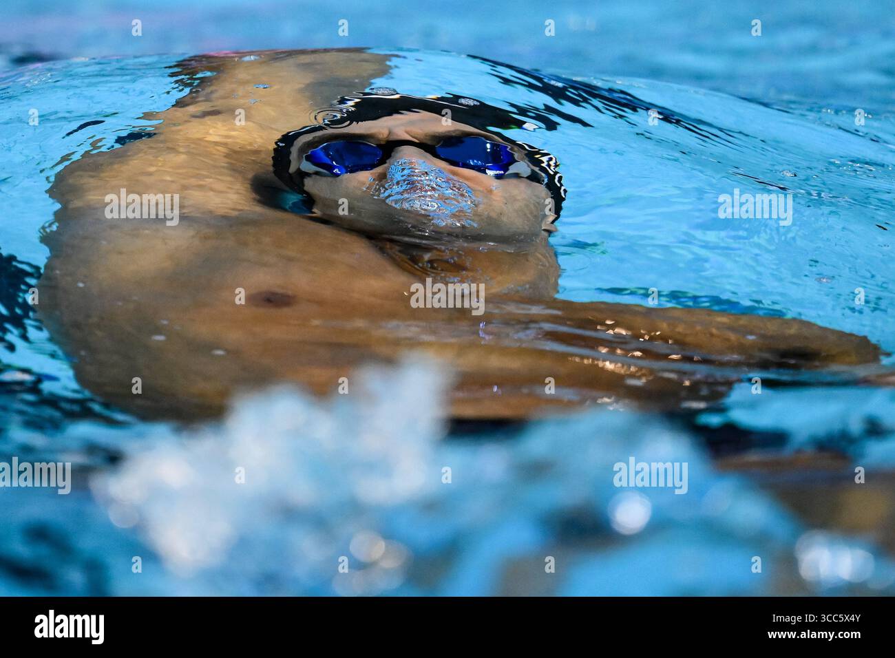 Thomas Ceccon of Italy competes in the swimming 100m Backstroke Men ...