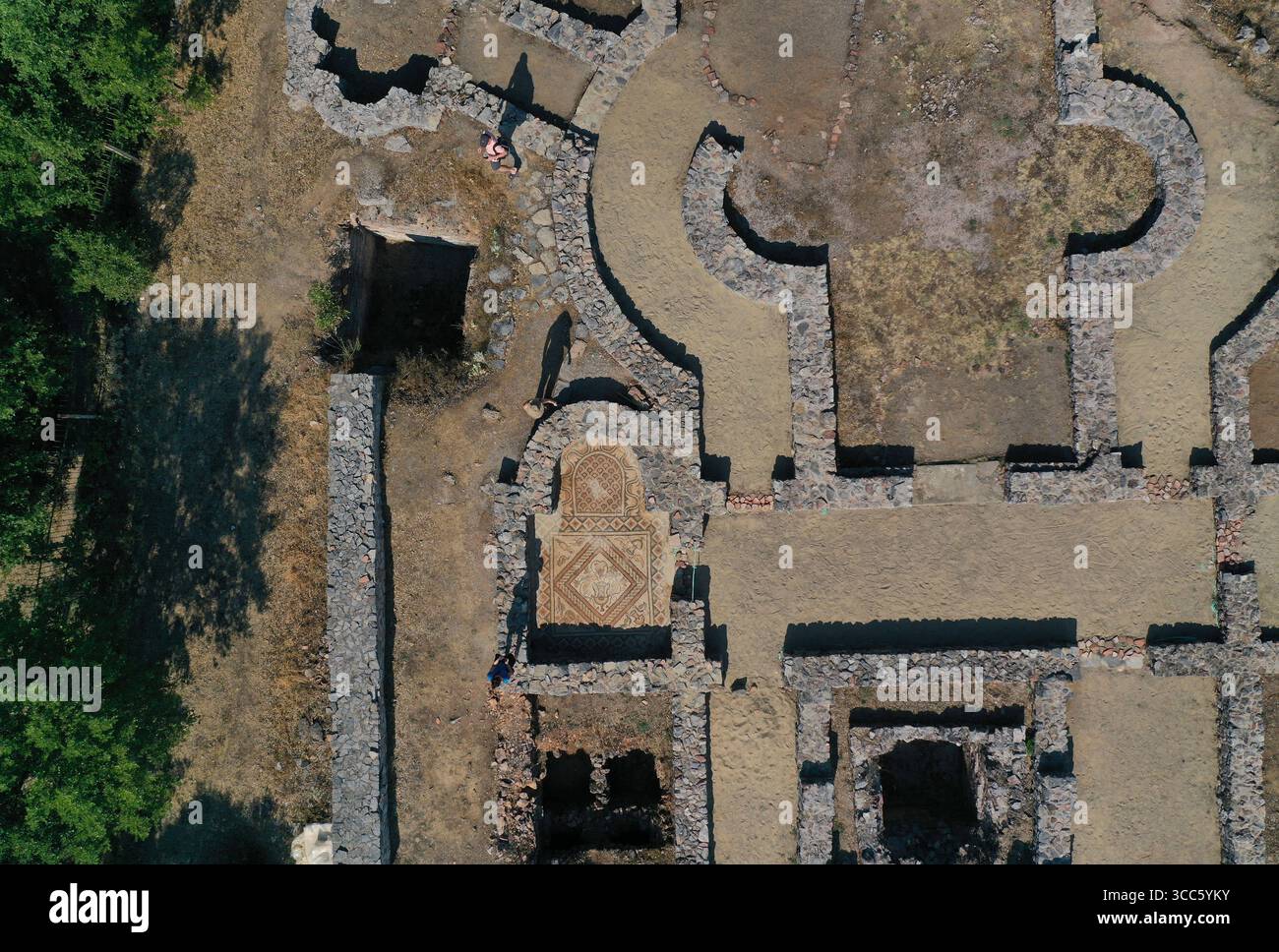 Tourists visit the IV-V century mosaic at the ruins of a Paleochristian ...