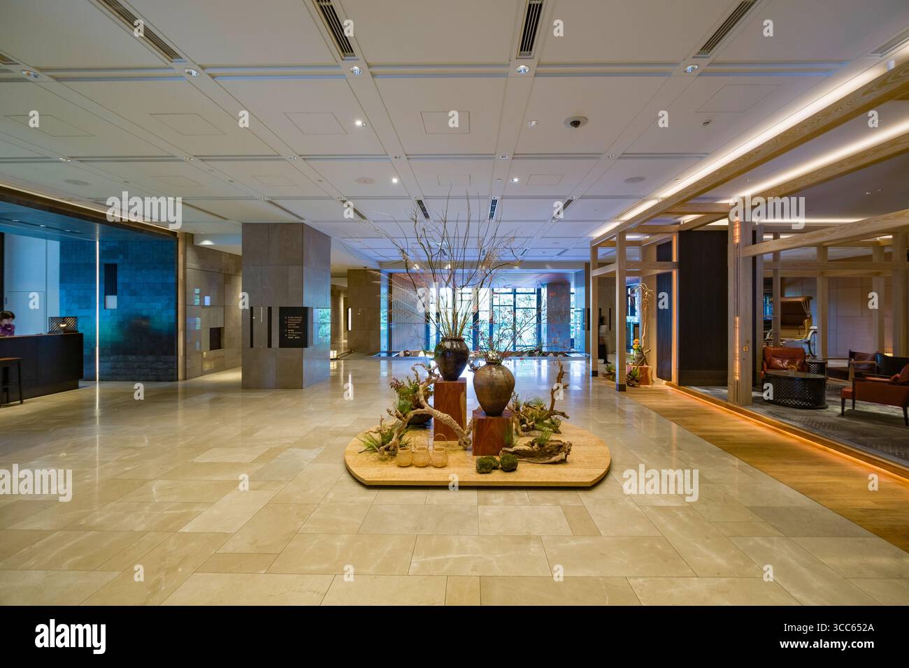 Spacious hotel lobby featuring contemporary decor, artistic displays ...