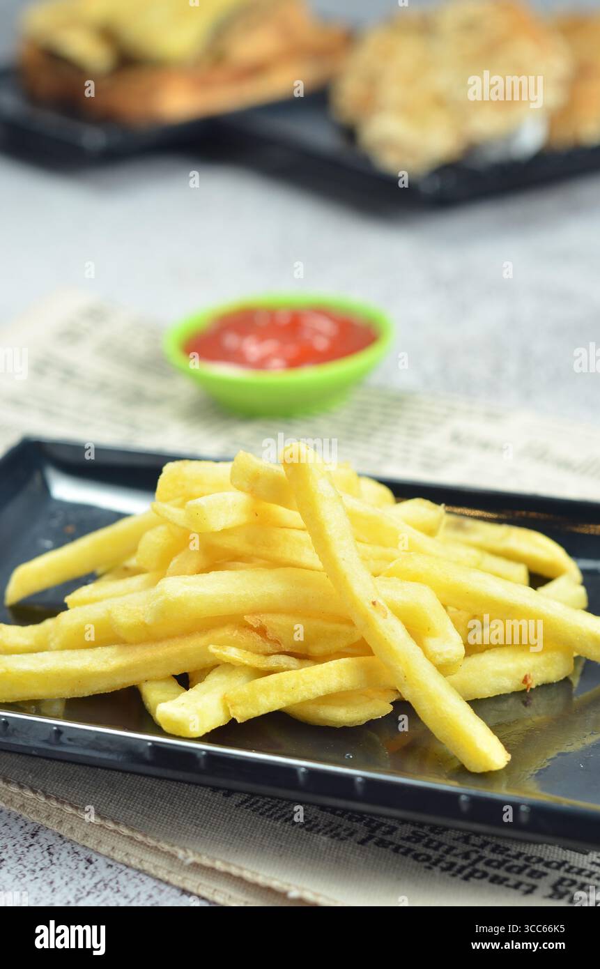 Plates of French fries with ketchup, a mesmerizing of crispy, golden ...