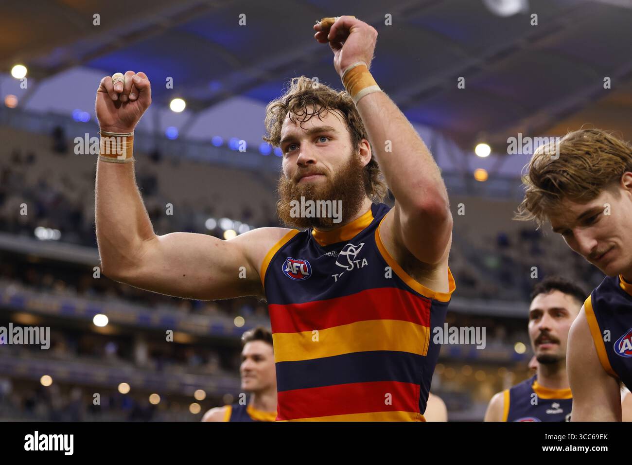 Riley Thilthorpe of the Crows celebrates the win as they walk off the ...