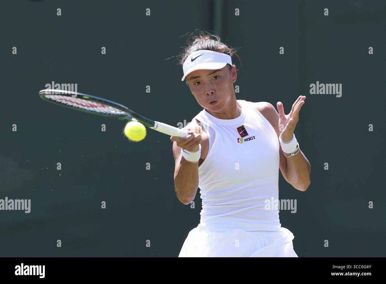 Chinese tennis player Yue Yuan (CHN) in action at the 2025 Wimbledon ...