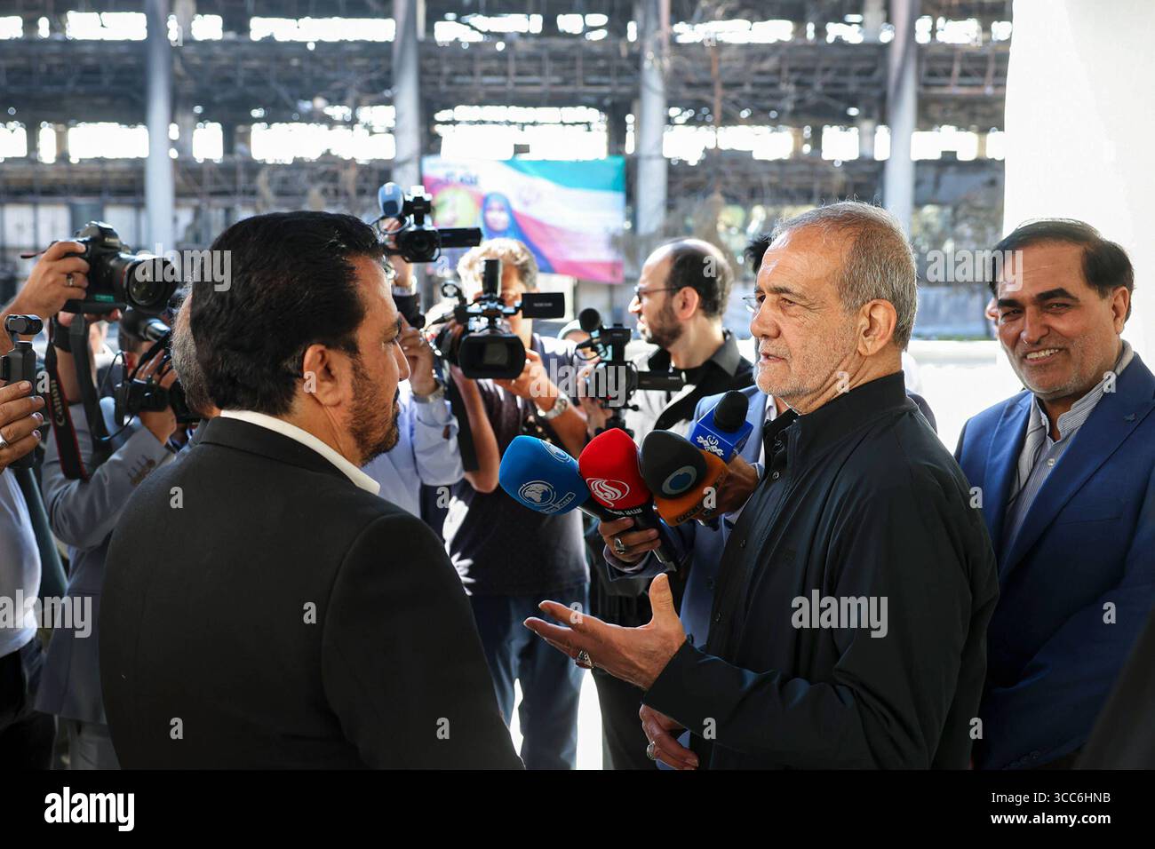Iranian President Masoud Pezeshkian visits the headquarters of the ...