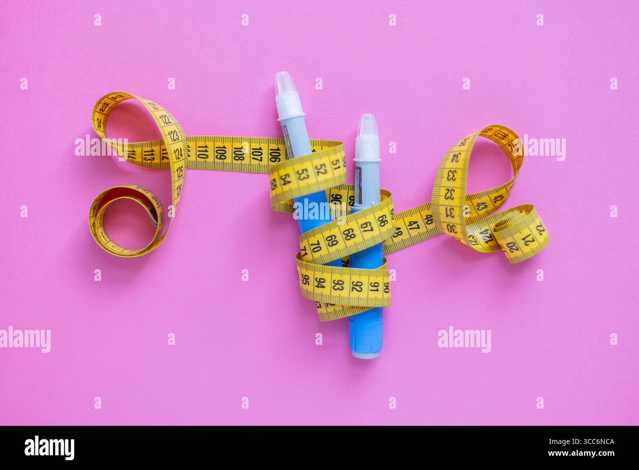 Insulin Injection Pens And Measuring Tape On Pink Surface. Concept Of ...