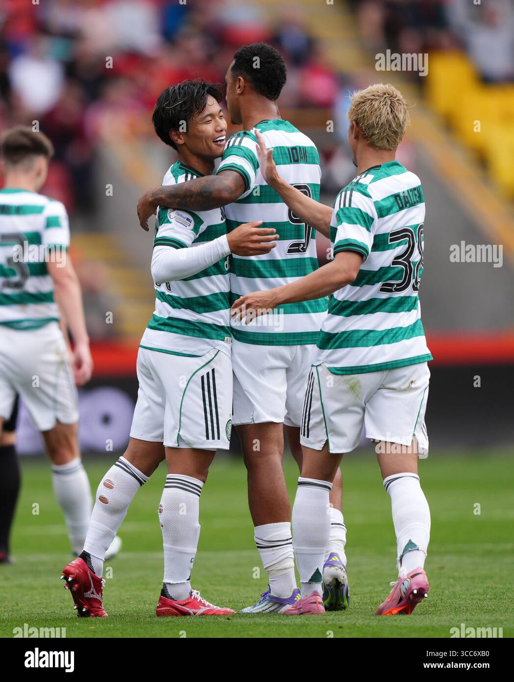 Celtic's Reo Hatate (left) celebrates scoring their side's second goal ...