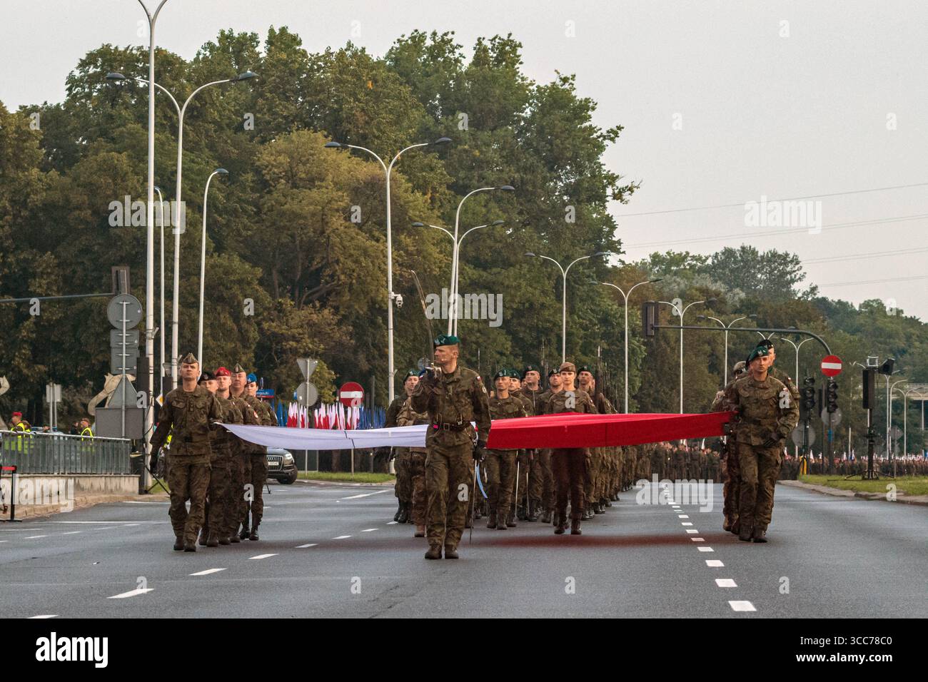 Soldiers seen marching with a Polish flag. Polish armed forces and ...
