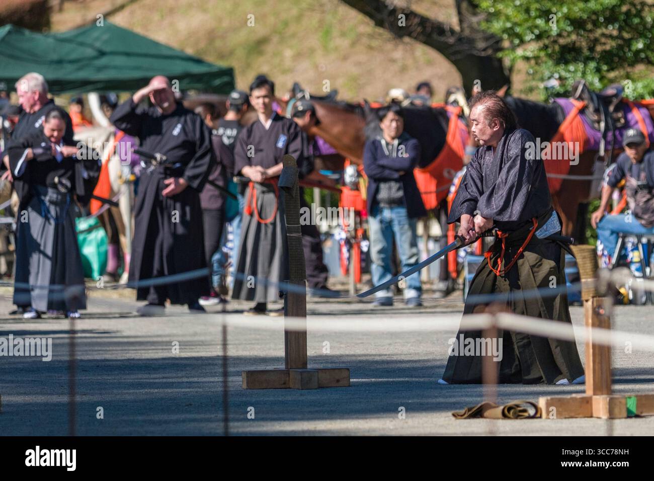 A samurai performs a sword demonstration at a cultural festival ...