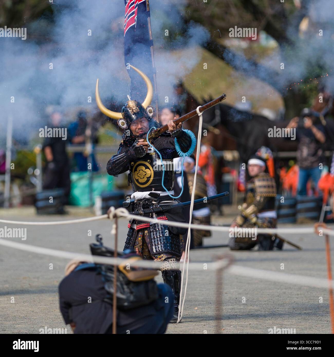 A samurai warrior wearing traditional armor giving gunnery ...
