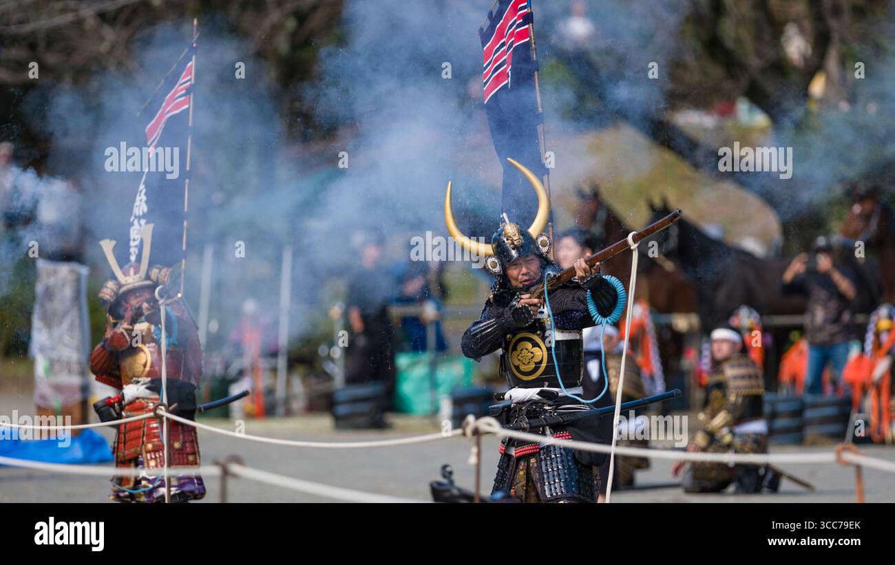 Historical reenactment featuring samurai warriors giving gunnery ...
