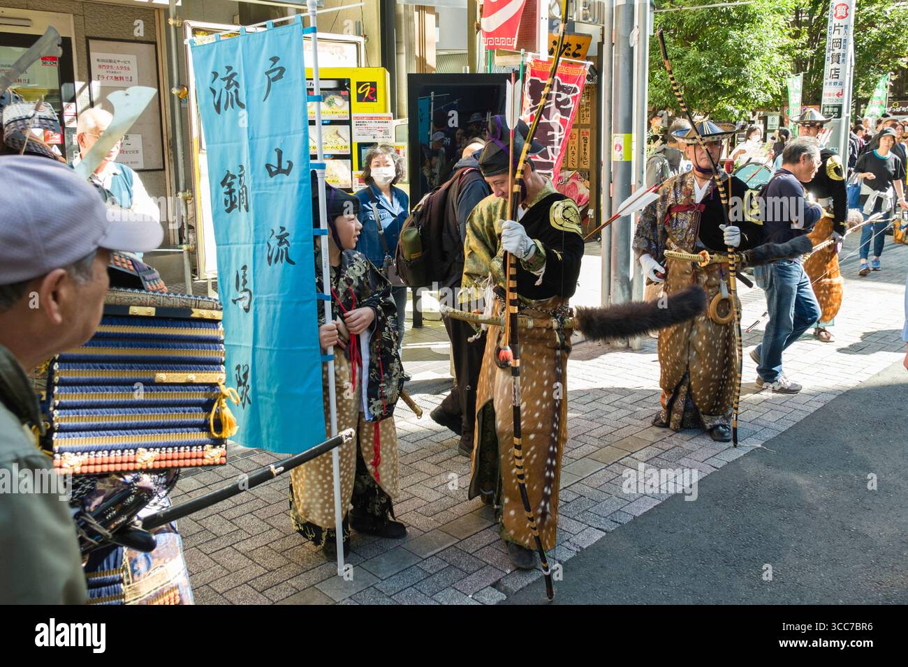 Men dressed as feudal archers before the start of the Machida Jidai ...