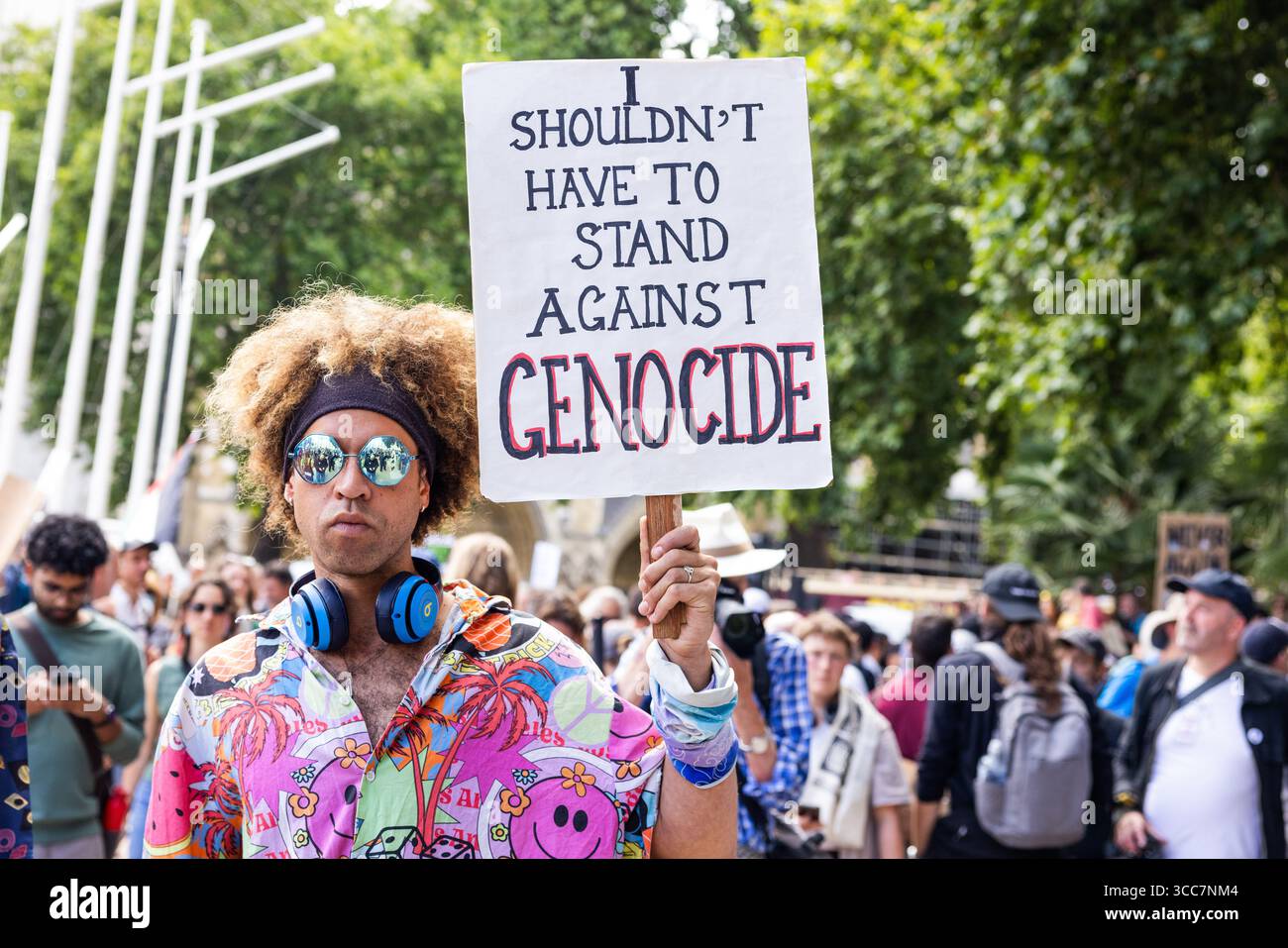 London, UK. 09 AUG, 2025. Person holds "I shouldn't have to stand ...
