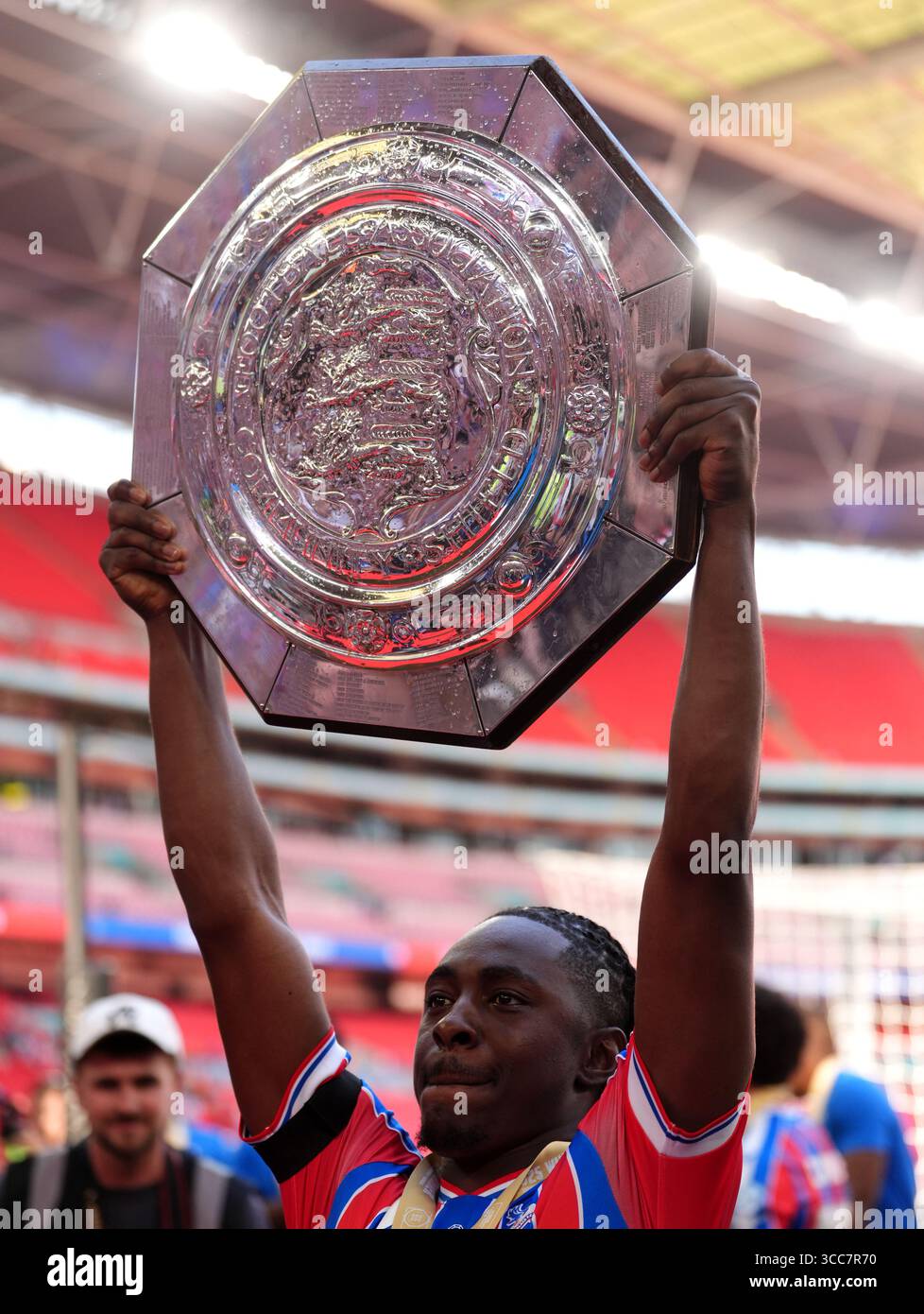 Crystal Palace's Eberechi Eze lifts the Community Shield trophy ...
