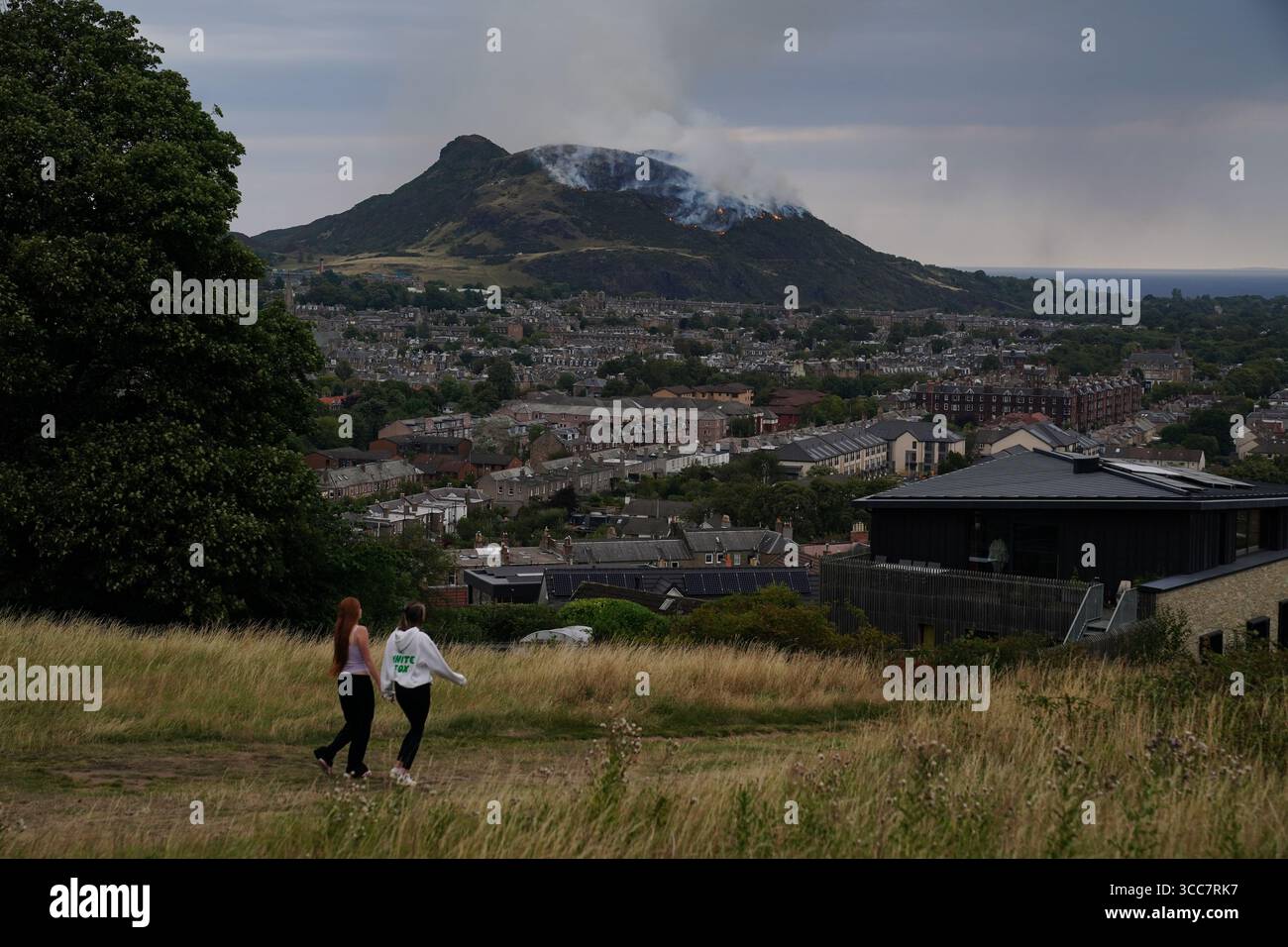 View of flames and smoke from a fire on Arthur's Seat in Holyrood Park ...