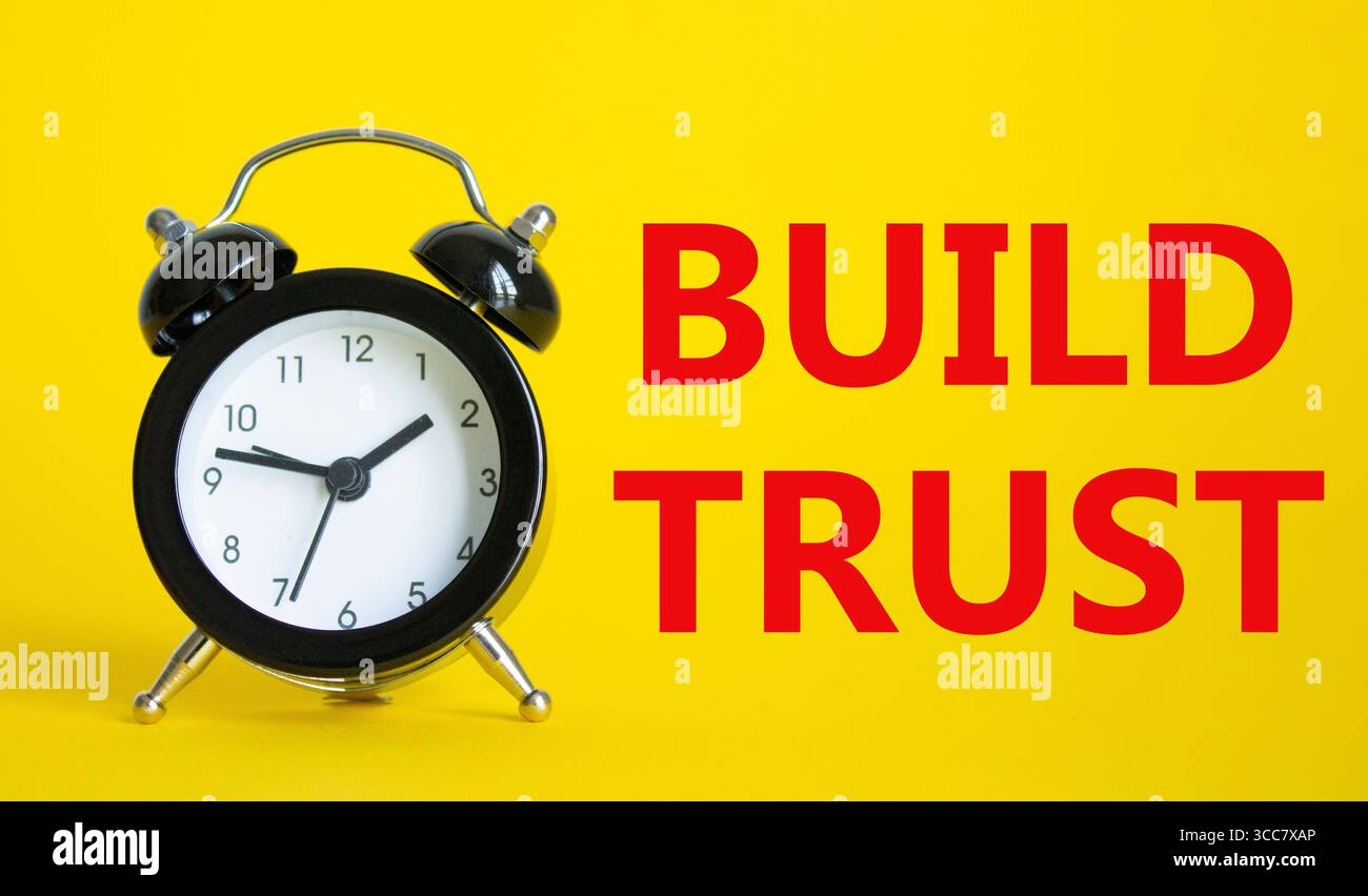 Build trust symbol. Beautiful yellow background with alarm clock ...