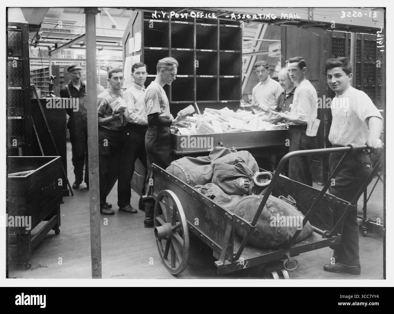 Postal service sorting Black and White Stock Photos & Images - Alamy
