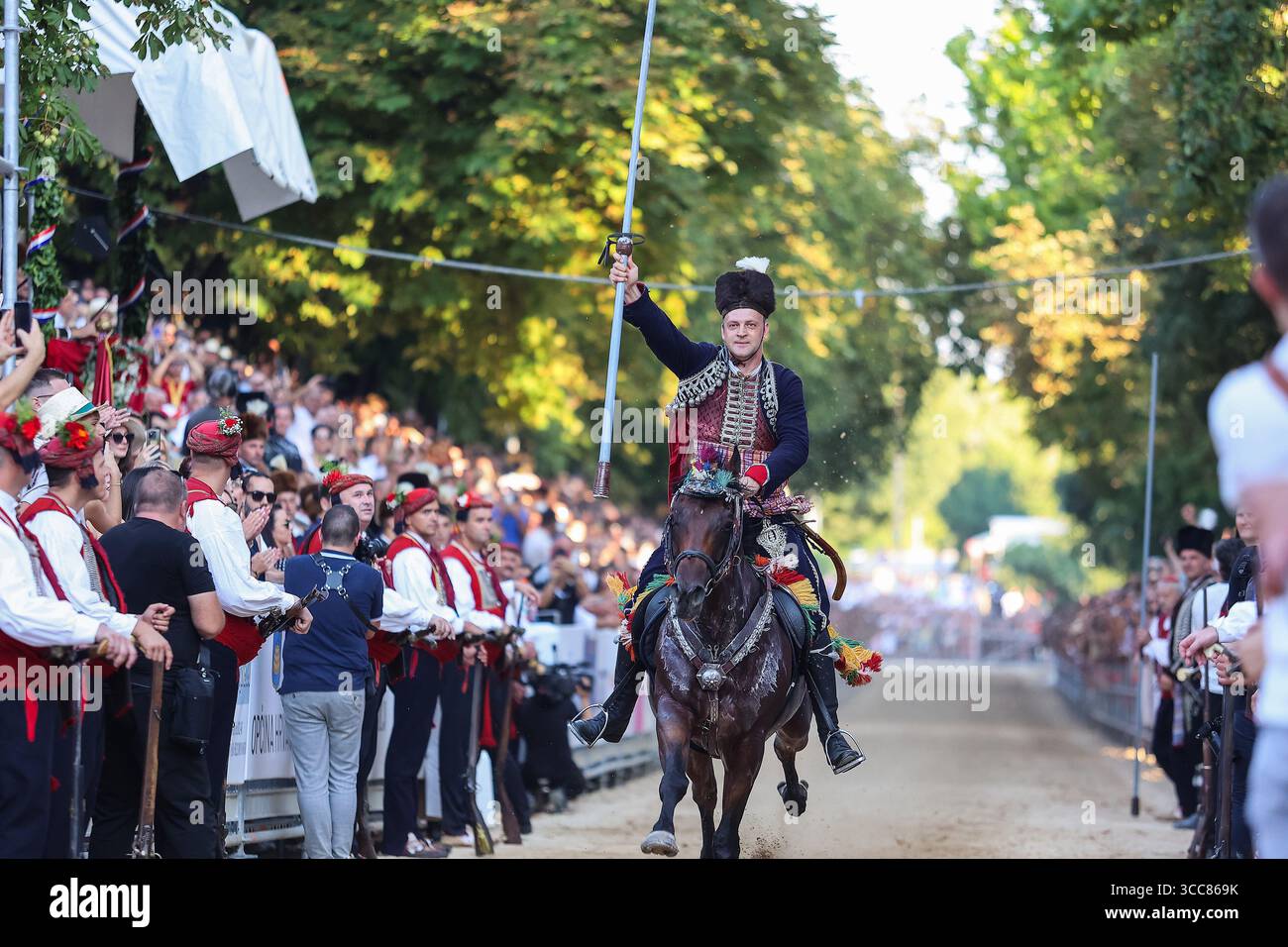 A rider Frano Talaja hits the ring (alka) with his spear during the ...