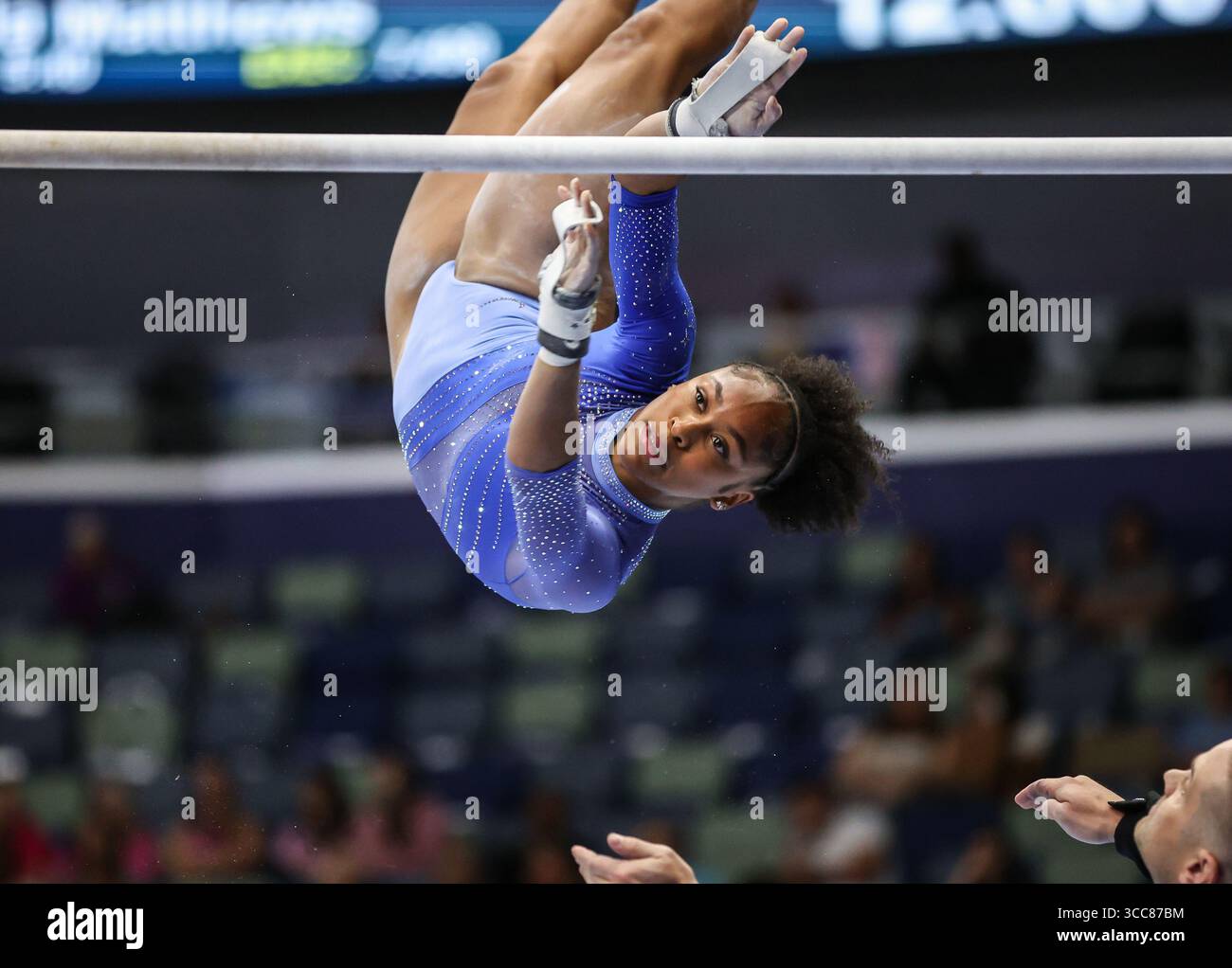 August 8, 2025: Skyle Blakely transitions between the uneven bars ...